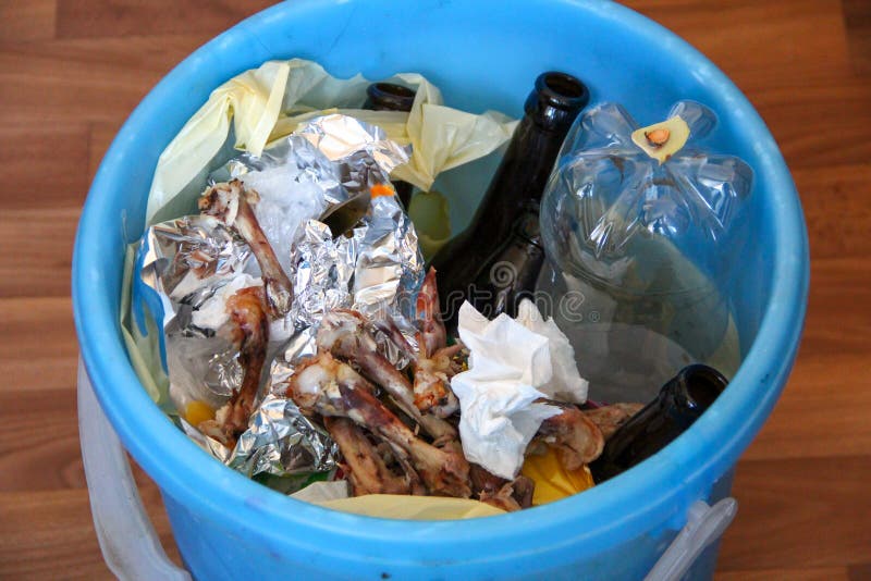 Trash Bin with Leftover Food and Chicken Bones, Close-up Stock Photo ...