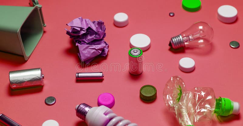 Trash Bins and Assorted Garbage Isolated on Green Stock Photo - Image ...
