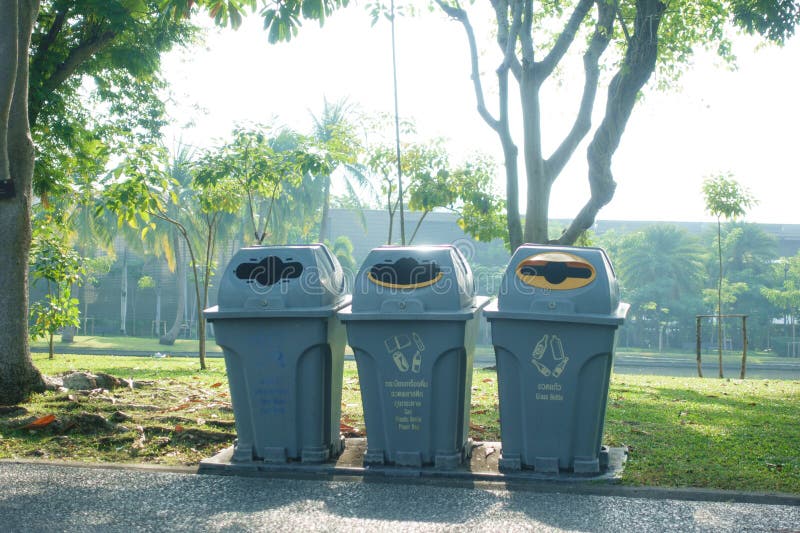 Trash Bins in Park with Clear Recycling Instructions, Surrounded by ...