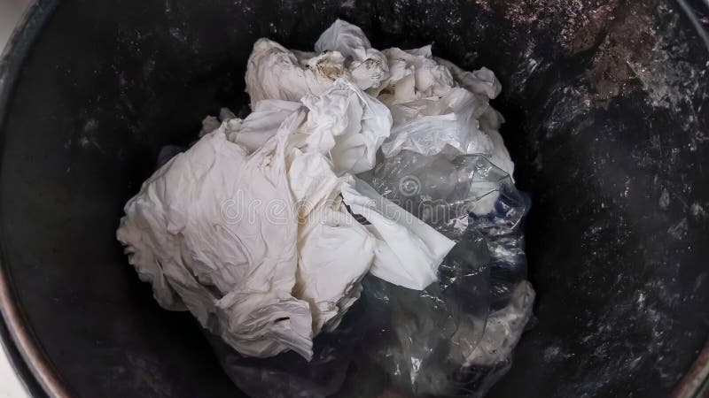 Close Up Trash Can Containing Some Trash in the Form of Used Tissue and ...