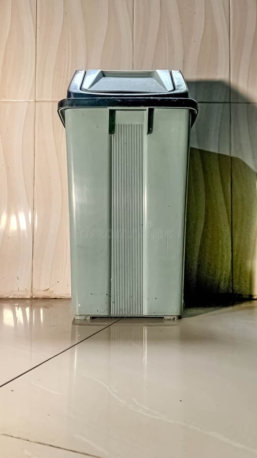 A trash can in the house stock photo. Image of curtains - 300614274