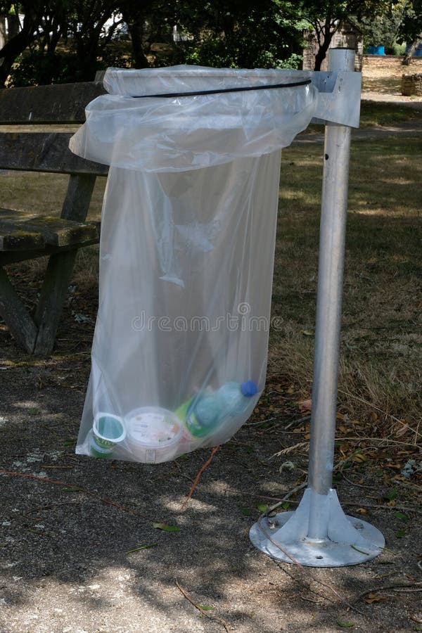 Trash Can with a Plastic Bag in a Public Park Stock Photo - Image of ...