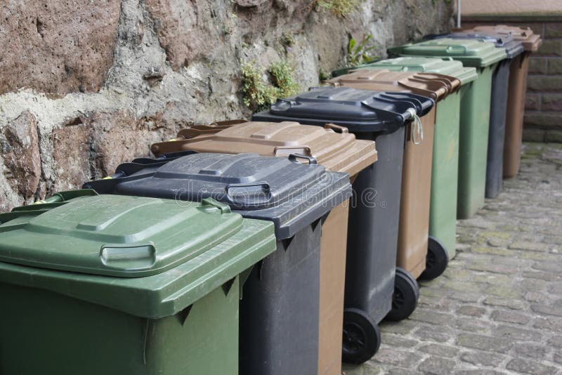 Trash cans in a row stock image. Image of trashcan, floor - 33768747