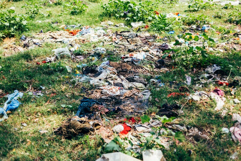 Trash disposed in garden stock image. Image of garden - 49477931