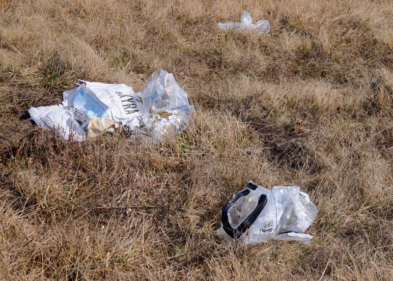 Trash dumped in a field editorial stock photo. Image of dumped - 310132253