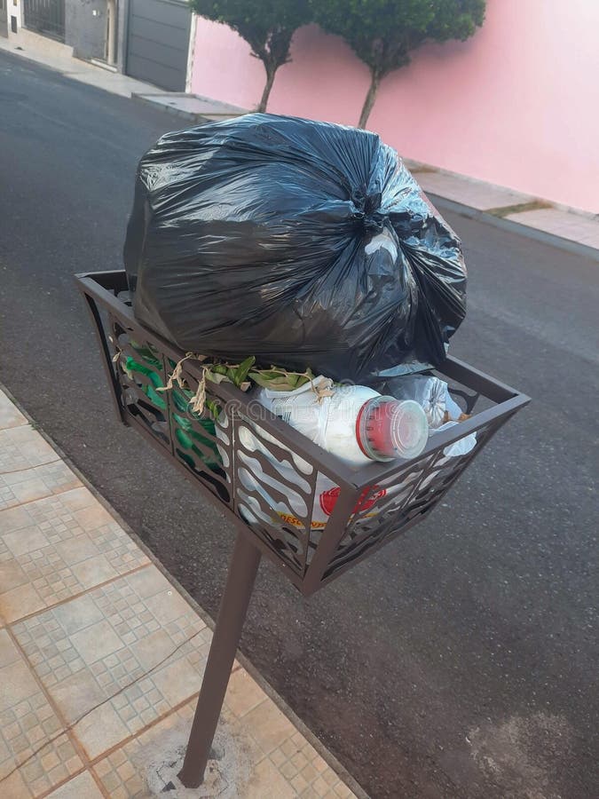 Trash Garbage Basket on a Street with Houses Stock Photo - Image of ...