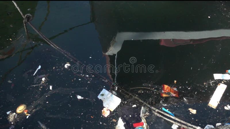 Trash and Garbage Floating on the Surface of the Water. Stock Video ...