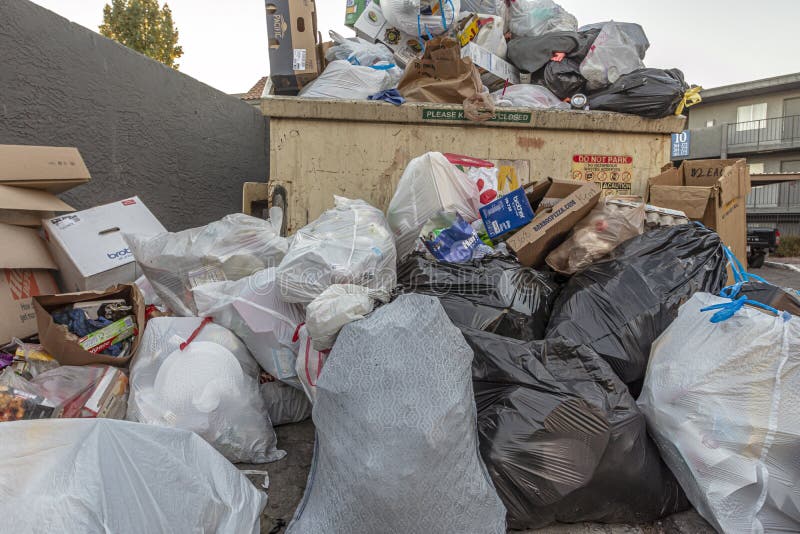 Trash Overflowing from a Dumpster Stock Image - Image of dumpster ...