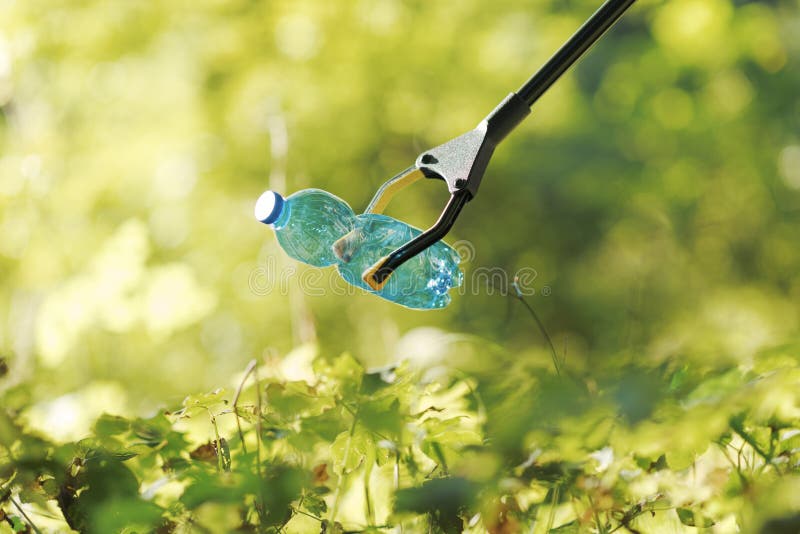 Trash Picker with Plastic Bottle Stock Image - Image of picking ...