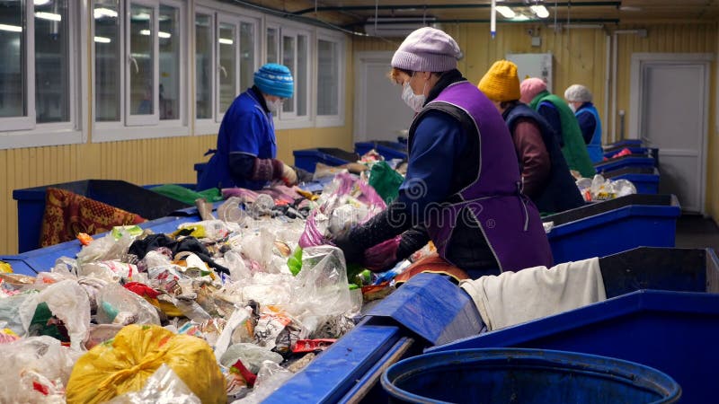 Sorting Garbage at Home for Recycling. a Woman Puts Used Things into ...