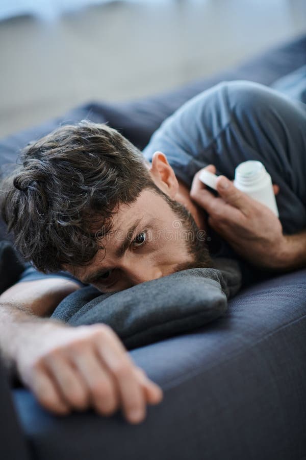Traumatized Suffering Man with Beard Lying Stock Image - Image of ...