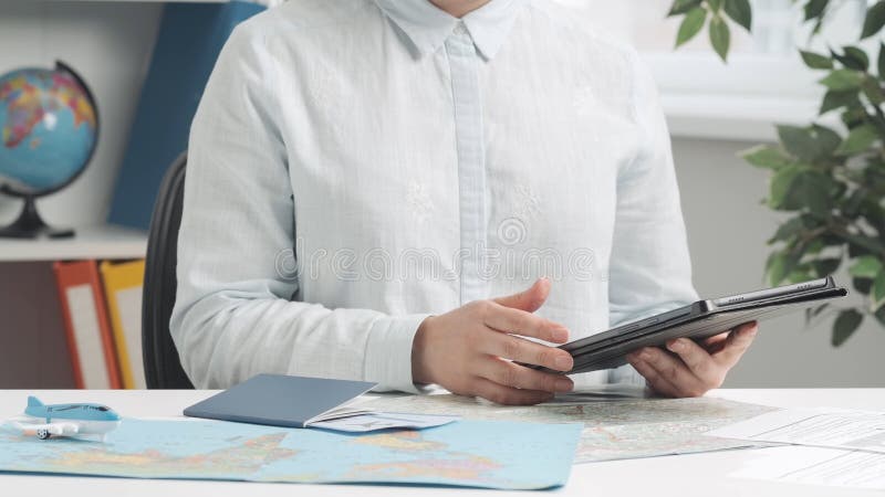 Planning a Trip with Modern Technology at a Travel Agency Stock Image ...