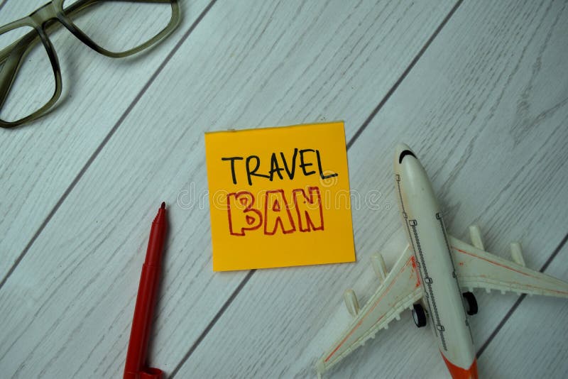 Travel Ban Write on Sticky Notes Isolated on Office Desk Stock Photo ...