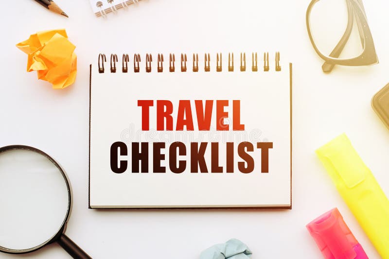 TRAVEL CHECKLIST. Text in Notebook on White Table with Office Tools ...