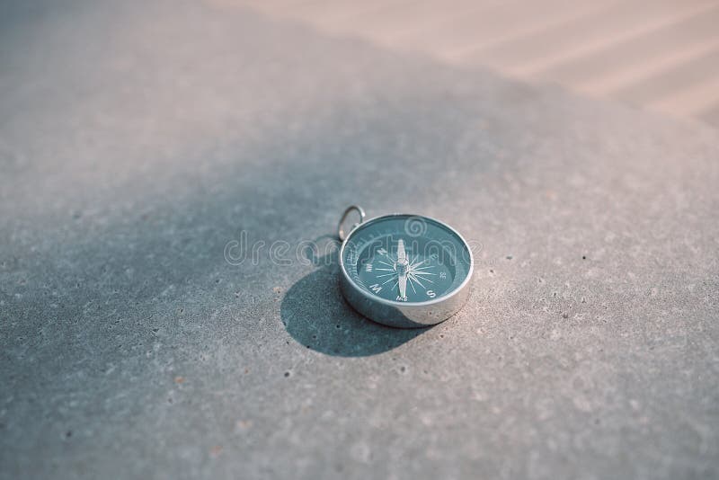 Round Stylish Compass on Concrete Background, Search Direction with ...