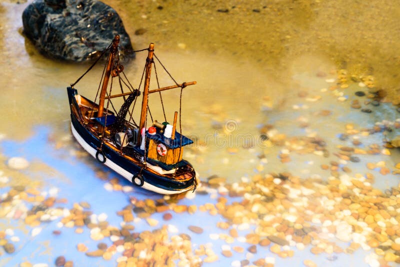 Travel Concept : Ship Model Toy on the Sand and Water Stock Photo ...