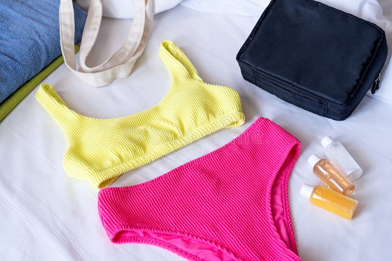 Travel Cosmetics Kit an Bathing Suit on Bed , Top View Stock Image ...