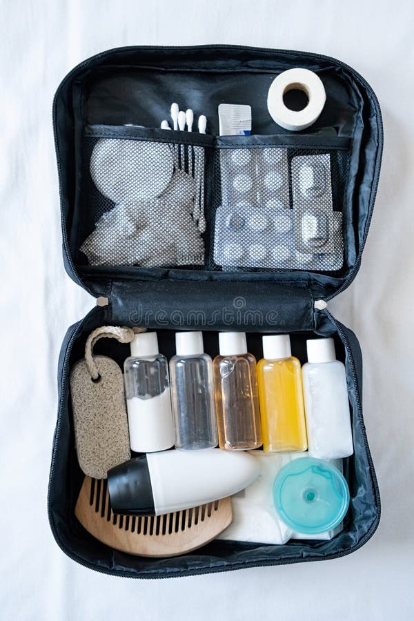 Travel Cosmetics Kit on Bed , Top View Stock Image - Image of mini ...
