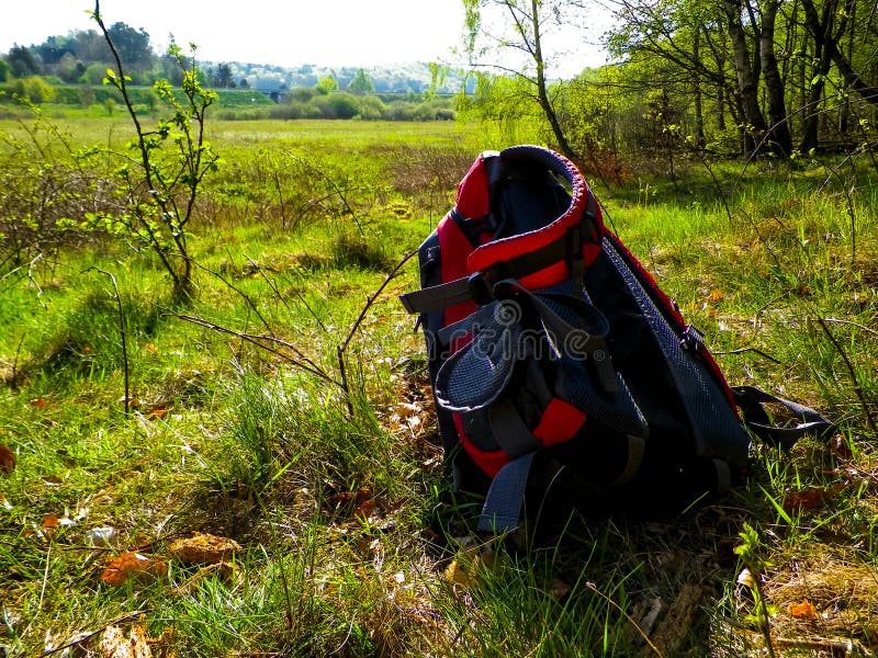 Travel and Excursions - Backpack Left in the Field Stock Image - Image ...