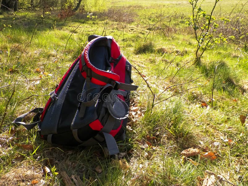Travel and Excursions - Backpack Left in the Field Stock Image - Image ...