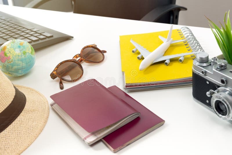 Travel Planning Concept at Office with Passports Sunglases and Computer ...