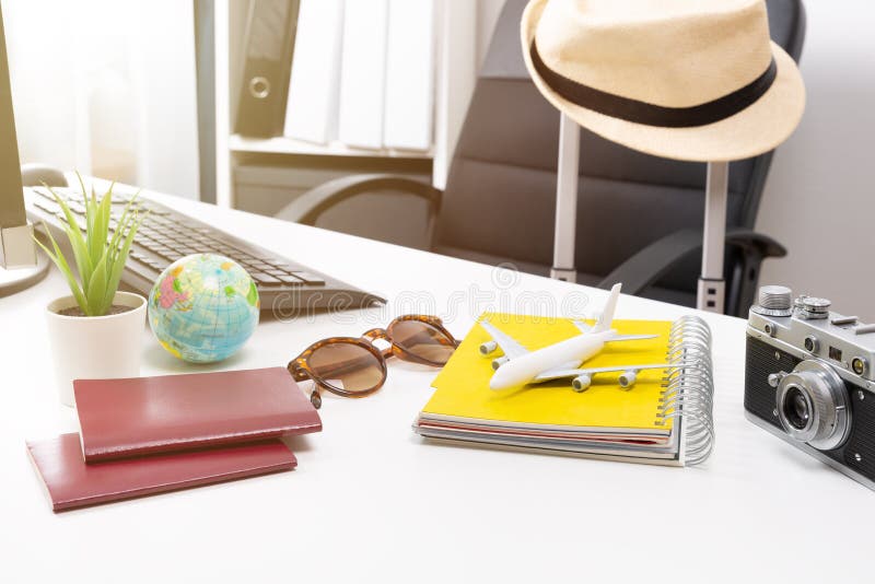 Travel Planning Concept at Office with Passports Sunglases and Computer ...