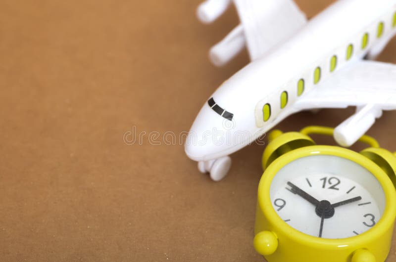 Travel Time Management Symbolized by Alarm Clock and Toy Plane on ...