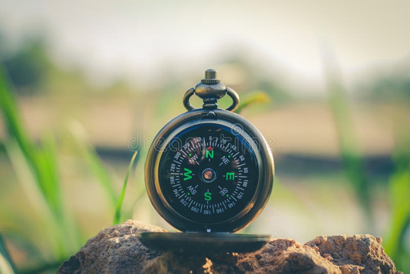 Travel of Tourists with Compass. Compass of Tourists on Mountain Stock ...