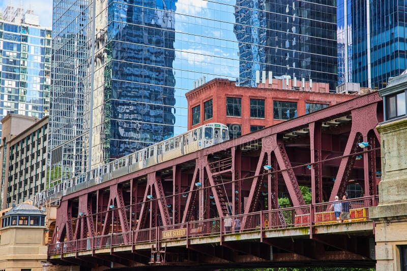 Travel Train in Chicago Going Over Bridge by Skyscrapers Stock Photo ...