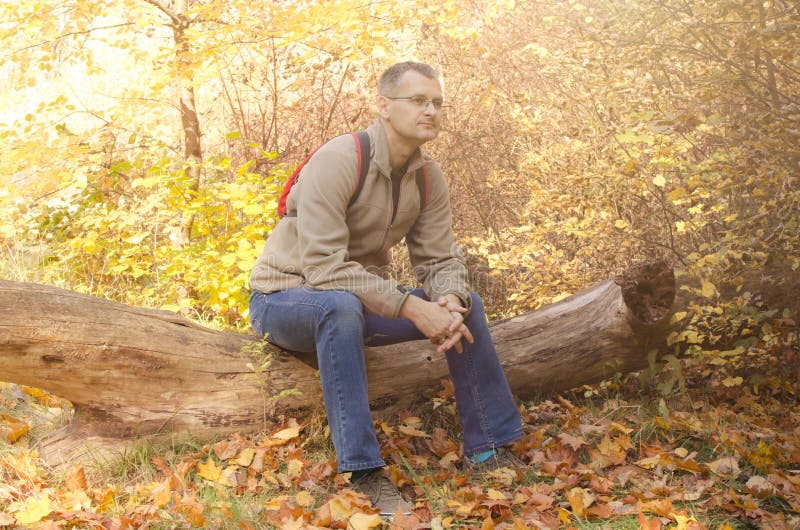 Man Resting In Autumn Forest. Stock Photo - Image of hiker, people ...