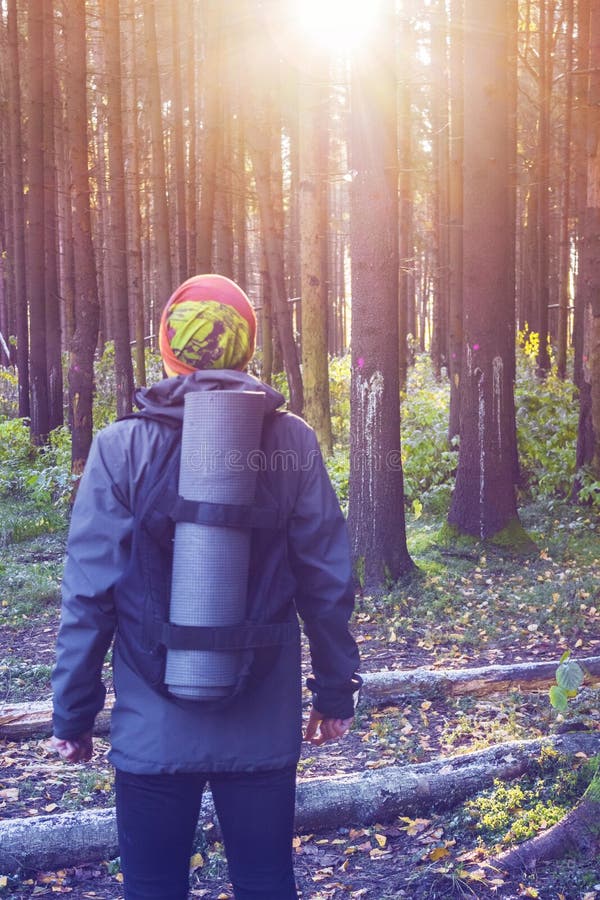 Traveler with a Backpack and Foam Stands in the Forest Stock Photo ...