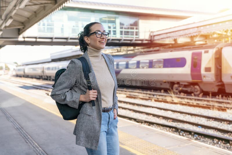 Traveler with Backpack Waiting for a Train at the Train Station. Travel ...
