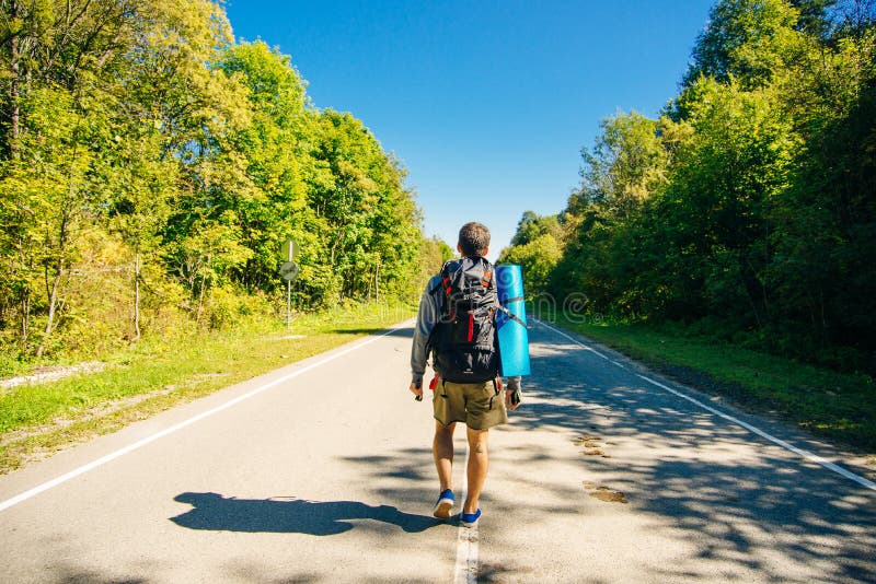 Traveler with a Big Backpack on the Road Editorial Stock Image - Image ...