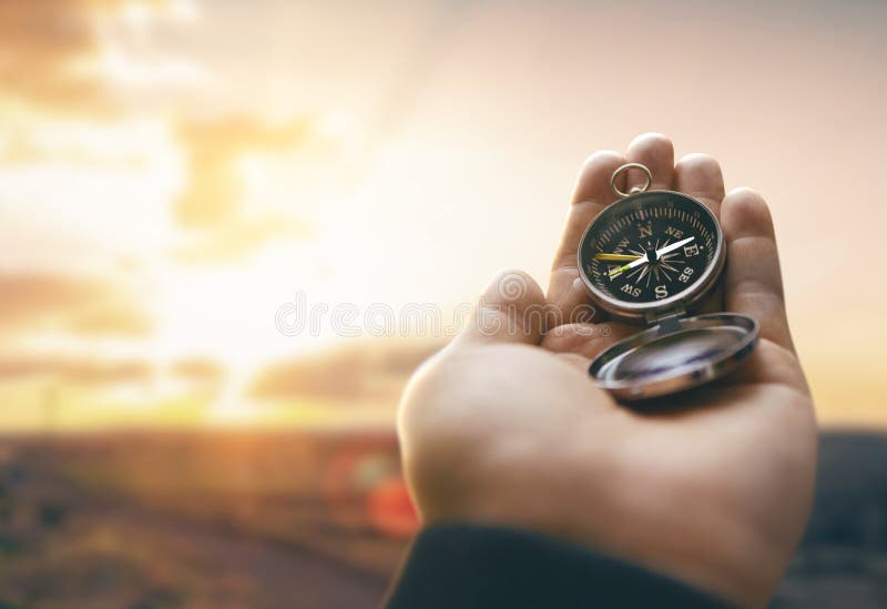Traveler Explorer Man Holding Compass in a Hand in Mountains at Sunrise ...