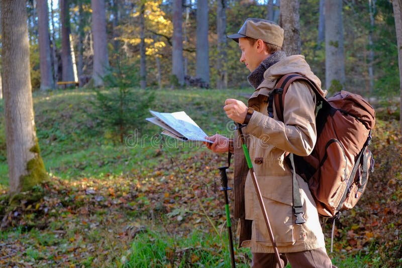 Traveler exploring the map stock photo. Image of adventure - 34858494