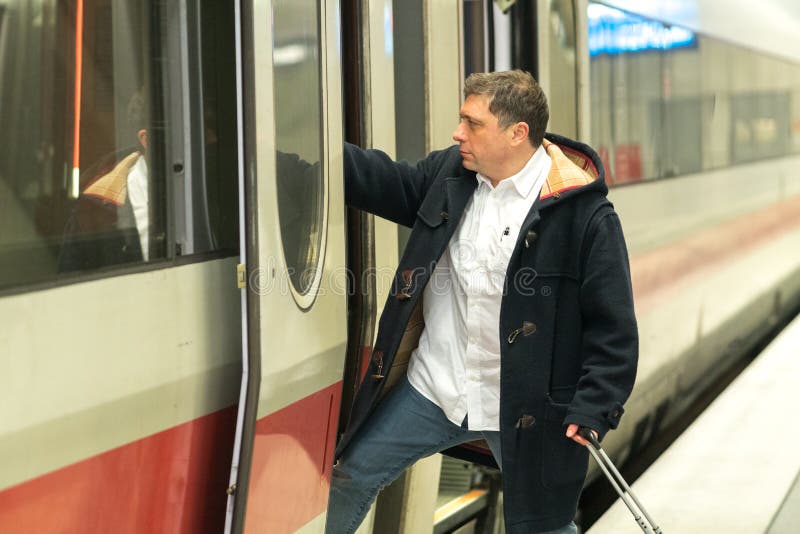 Man leaving by train stock photo. Image of commuting - 109407190