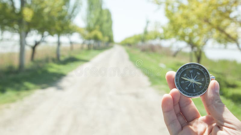 Compass on a road map stock image. Image of road, longitude - 28247439