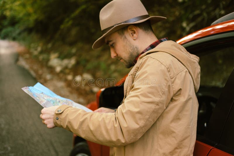 Traveler Man with Hat Looking Map Near Car in Autumn Forest Stock Photo ...