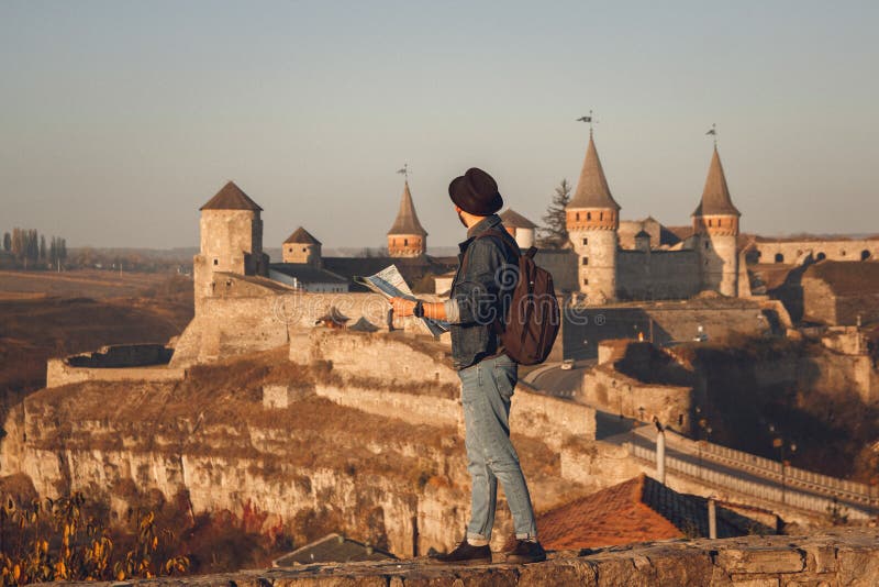 Traveler Man with a Map in His Hands Stands on the Background of the ...
