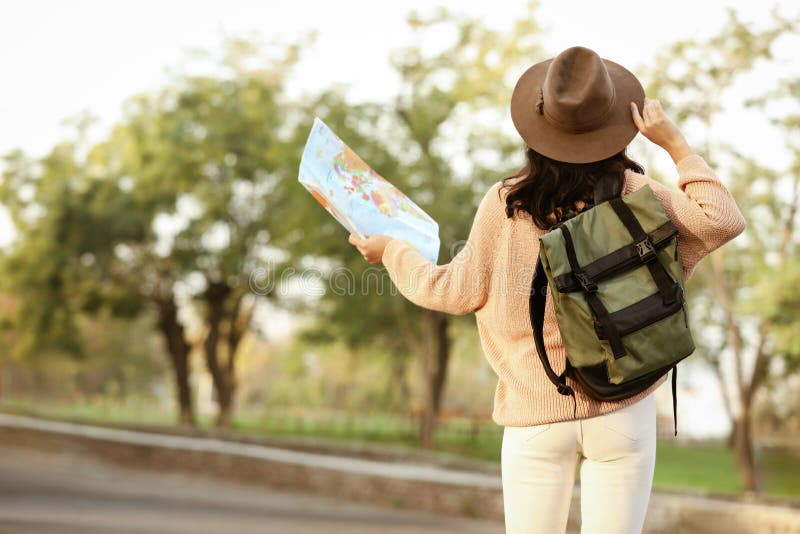 Traveler with Map and Backpack on City Street, Back View Stock Image ...