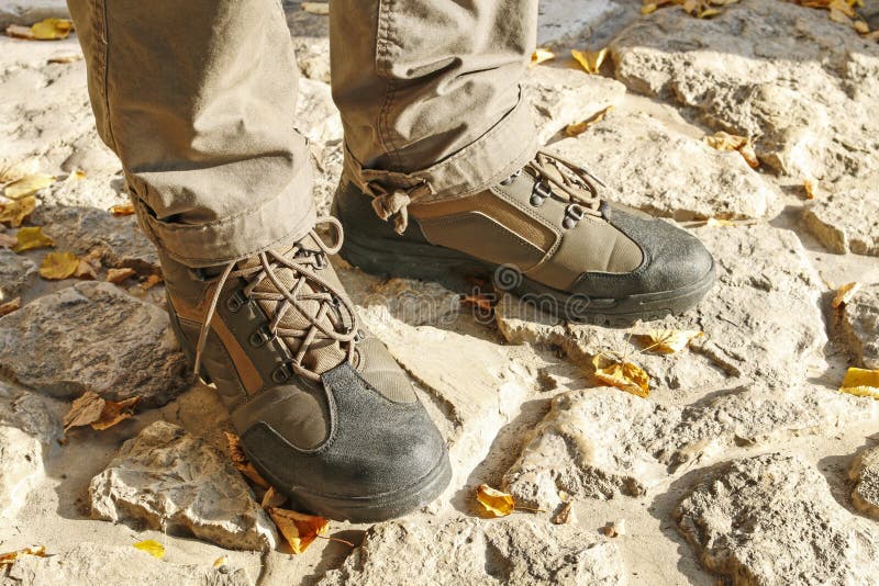 Traveler`s Boots on the Rock Stock Photo - Image of black, hiker: 229067528