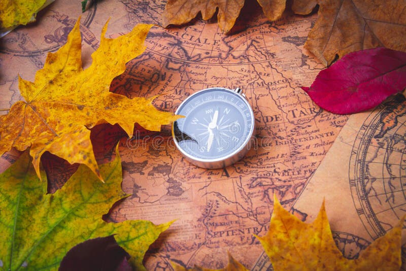 Traveler S Compass on Map in Bright Multi-colored Autumn Leaves ...