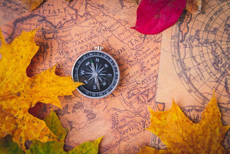 Traveler S Compass on Map in Bright Multi-colored Autumn Leaves ...