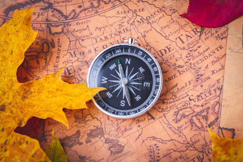 Traveler S Compass on Map in Bright Multi-colored Autumn Leaves ...