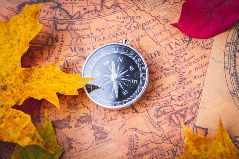 Traveler S Compass on Map in Bright Multi-colored Autumn Leaves ...