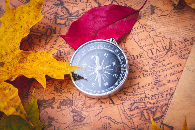 Traveler S Compass on Map in Bright Multi-colored Autumn Leaves ...