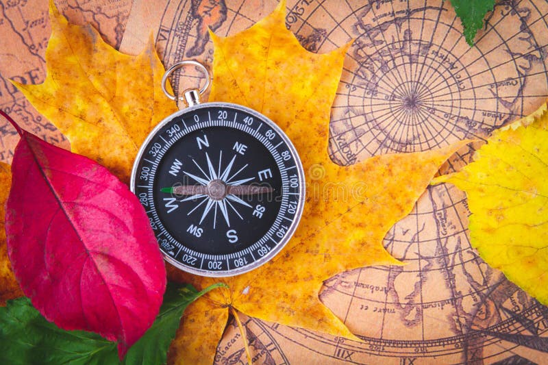 Traveler S Compass on Map in Bright Multi-colored Autumn Leaves ...