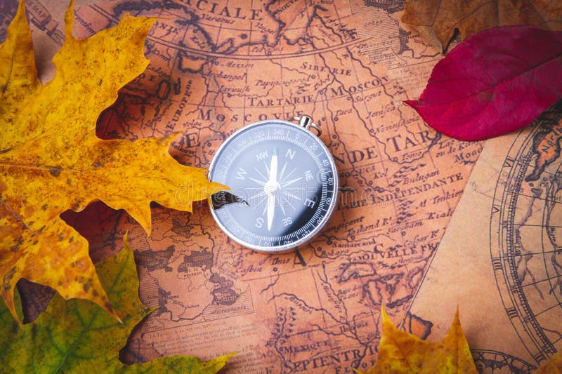 Traveler S Compass on Map in Bright Multi-colored Autumn Leaves ...