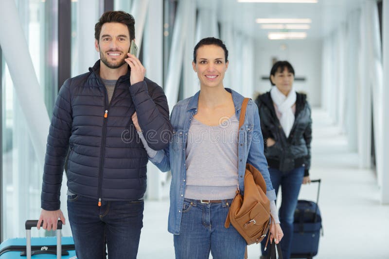 Traveler Using Smart Mobile Phone at Arrivals Stock Photo - Image of ...