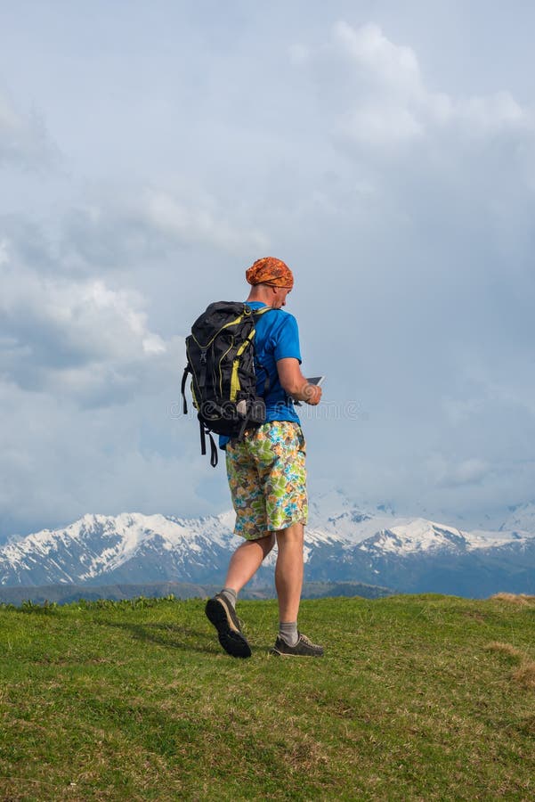 Traveler is Walking Along the Ridge. Back View Stock Photo - Image of ...